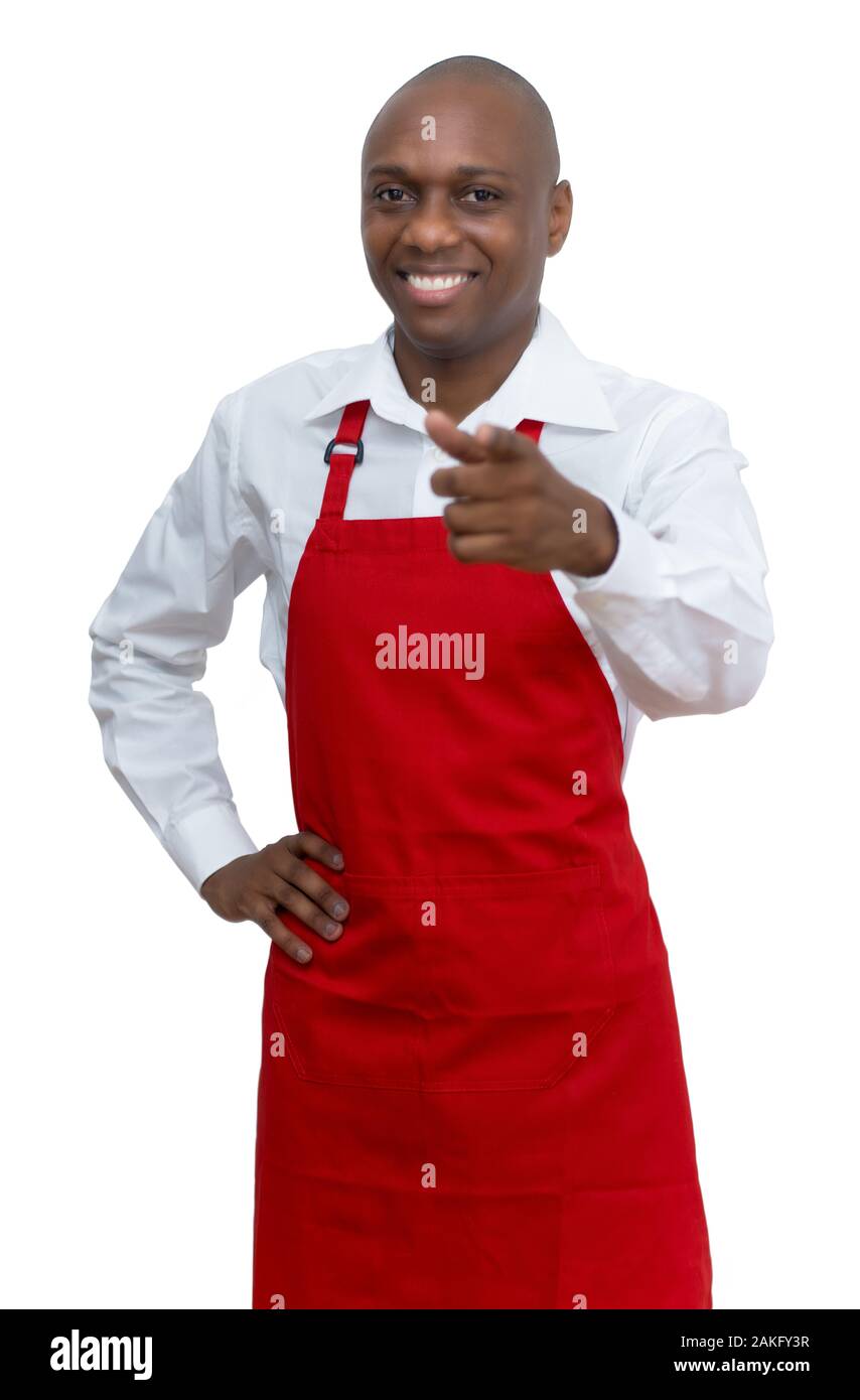 Friendly african american waiter with red apron isolated on white ...