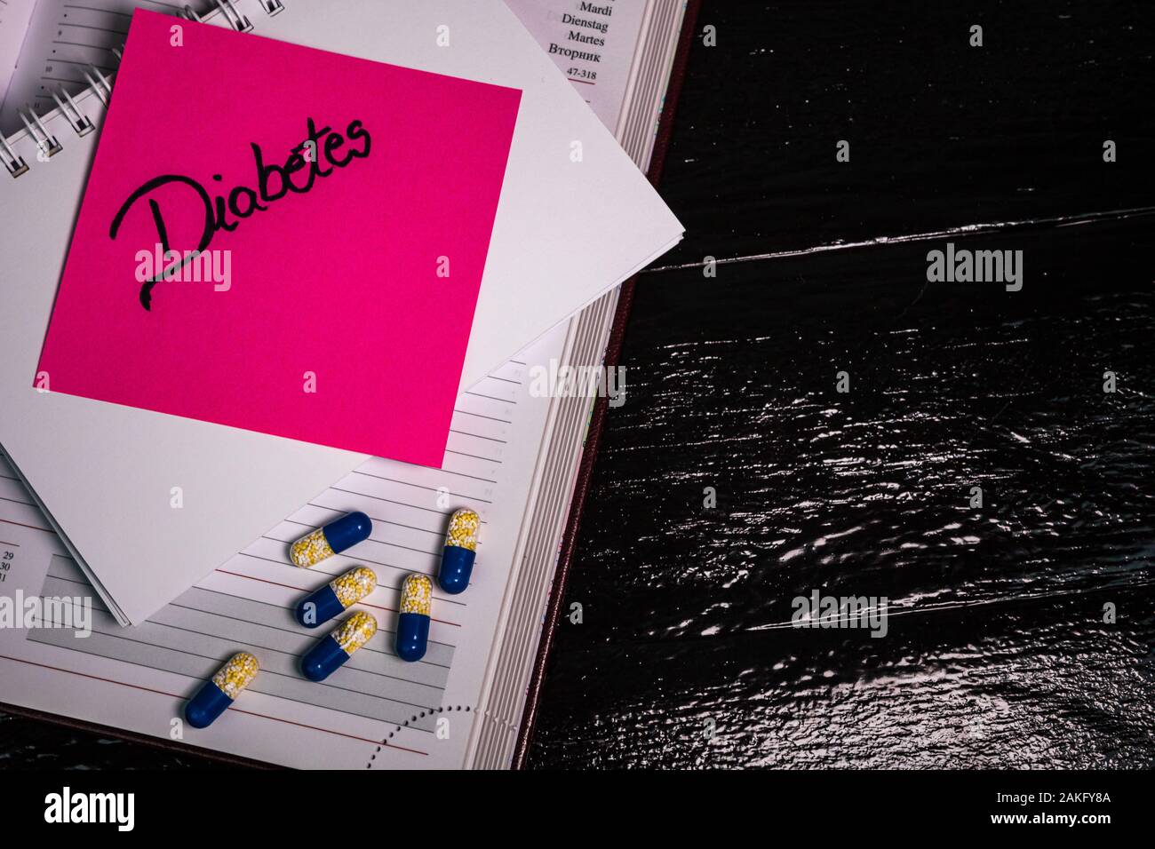 Writing Diabetes on memo post reminder. Text Diabetes on sticky paper ...