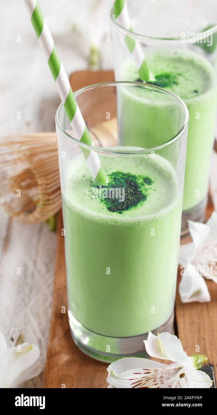 Green matcha milk in a tall glass Stock Photo - Alamy