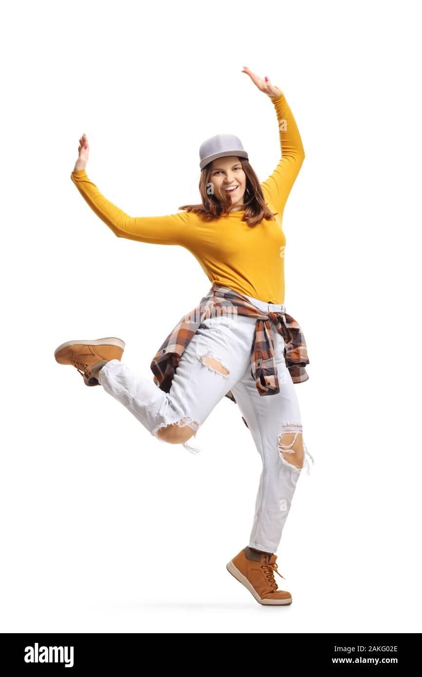 Full length portrait of a happy young woman dancing with raised arms ...