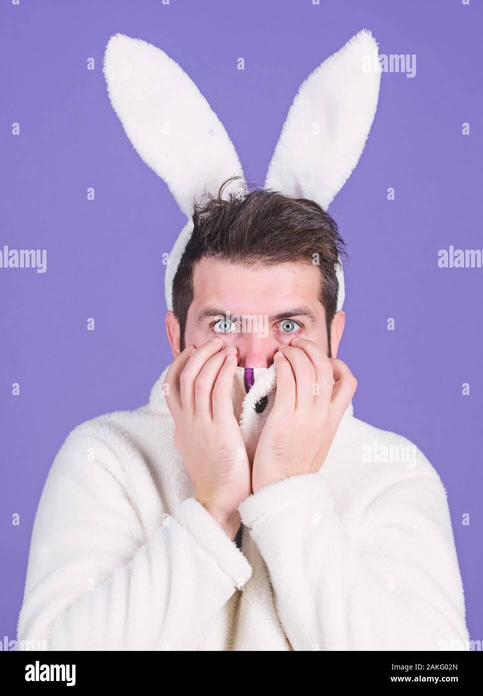 Cute bunny. Man handsome face wear white bunny ears. White bunny symbol ...