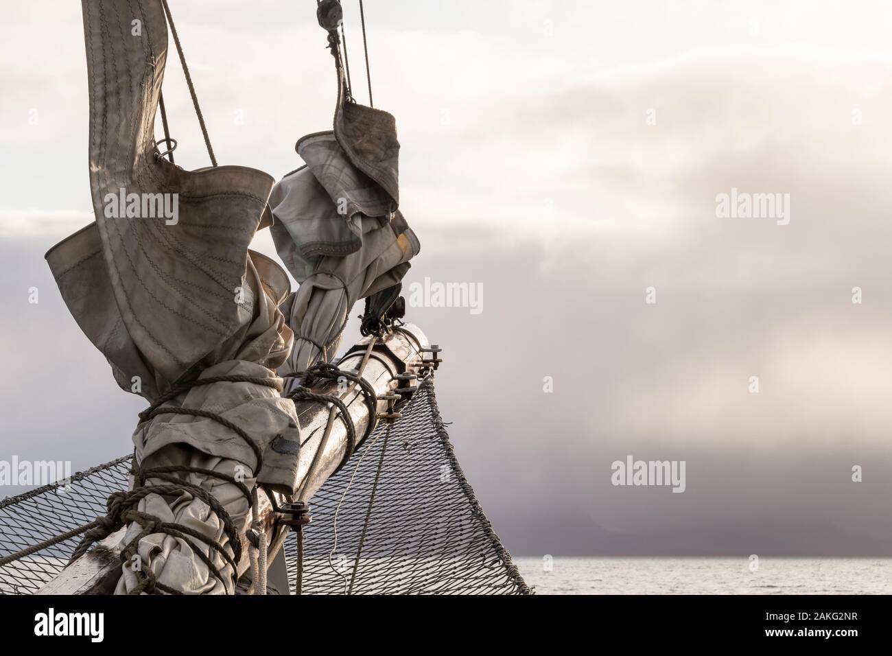 view on the ocean with mast of foredeck of a sailing ship Stock Photo ...