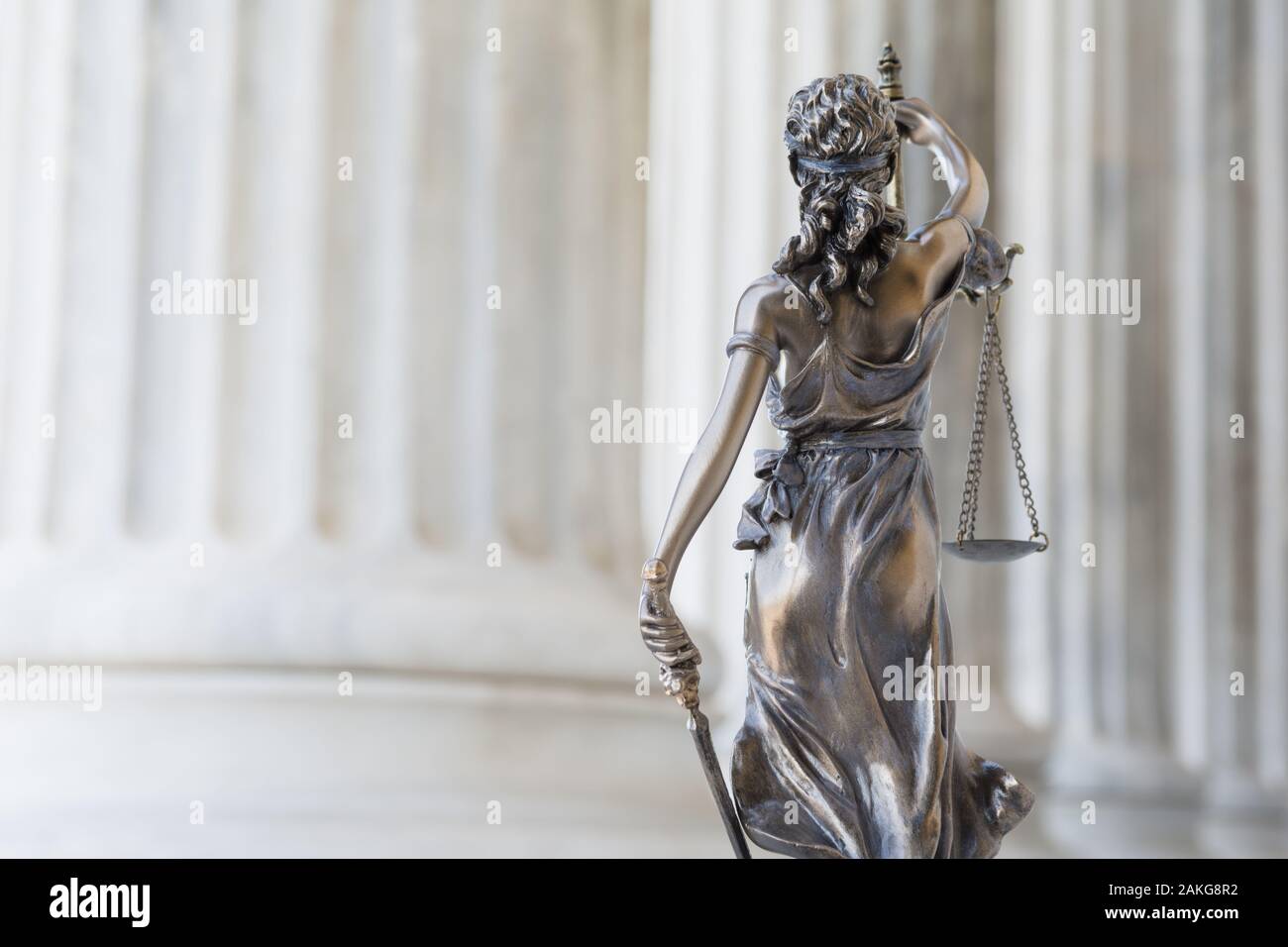 The statue of justice Themis or Justitia, the blindfolded goddess of ...