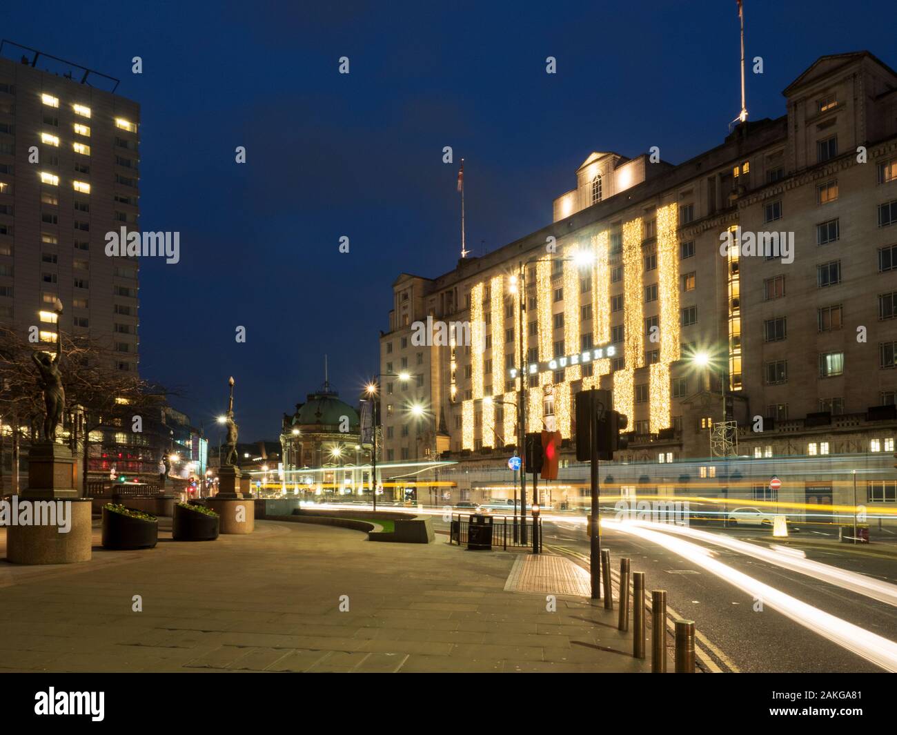 Fairy lights at dusk on The Queens Hotel and traffic trails in City ...