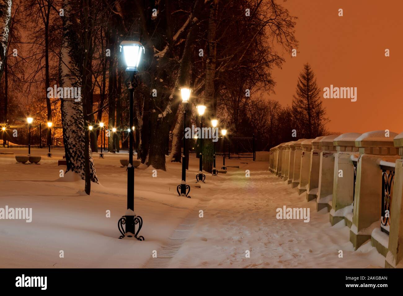 Winter park at night with decorations, lights, benches and trees Stock ...