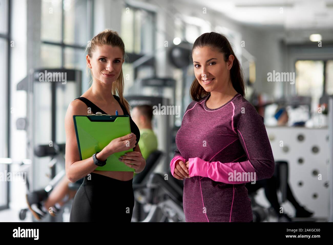 Woman with gym instructor hi-res stock photography and images - Alamy