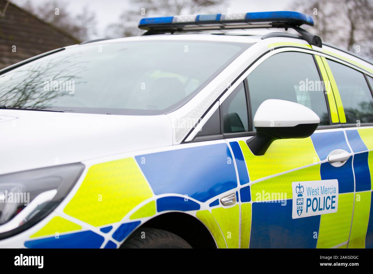 Nearside, front view close up of isolated West Mercia UK police car ...