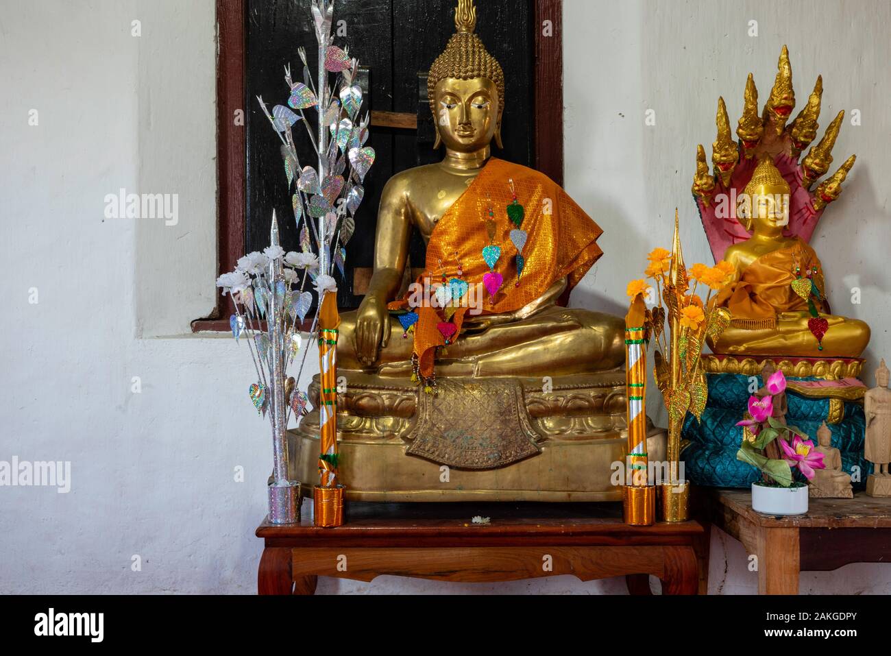 Sitting Buddha statues in the small temple atop Mount Phousi, Luang ...