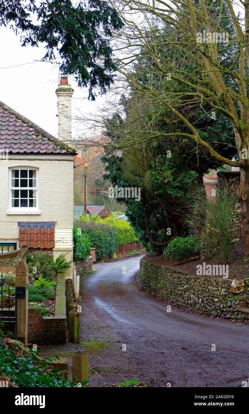 A view of the narrow street leading to the boatyard and River Bure in ...