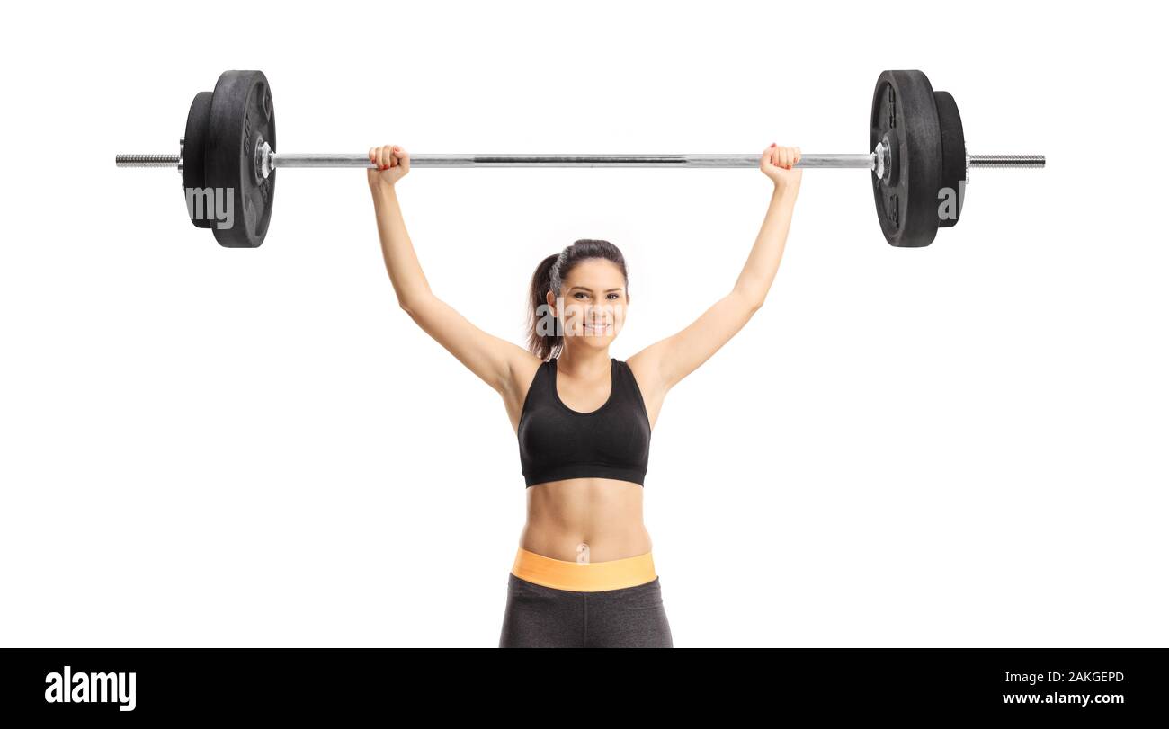 Young woman lifting a barbell isolated on white background Stock Photo ...