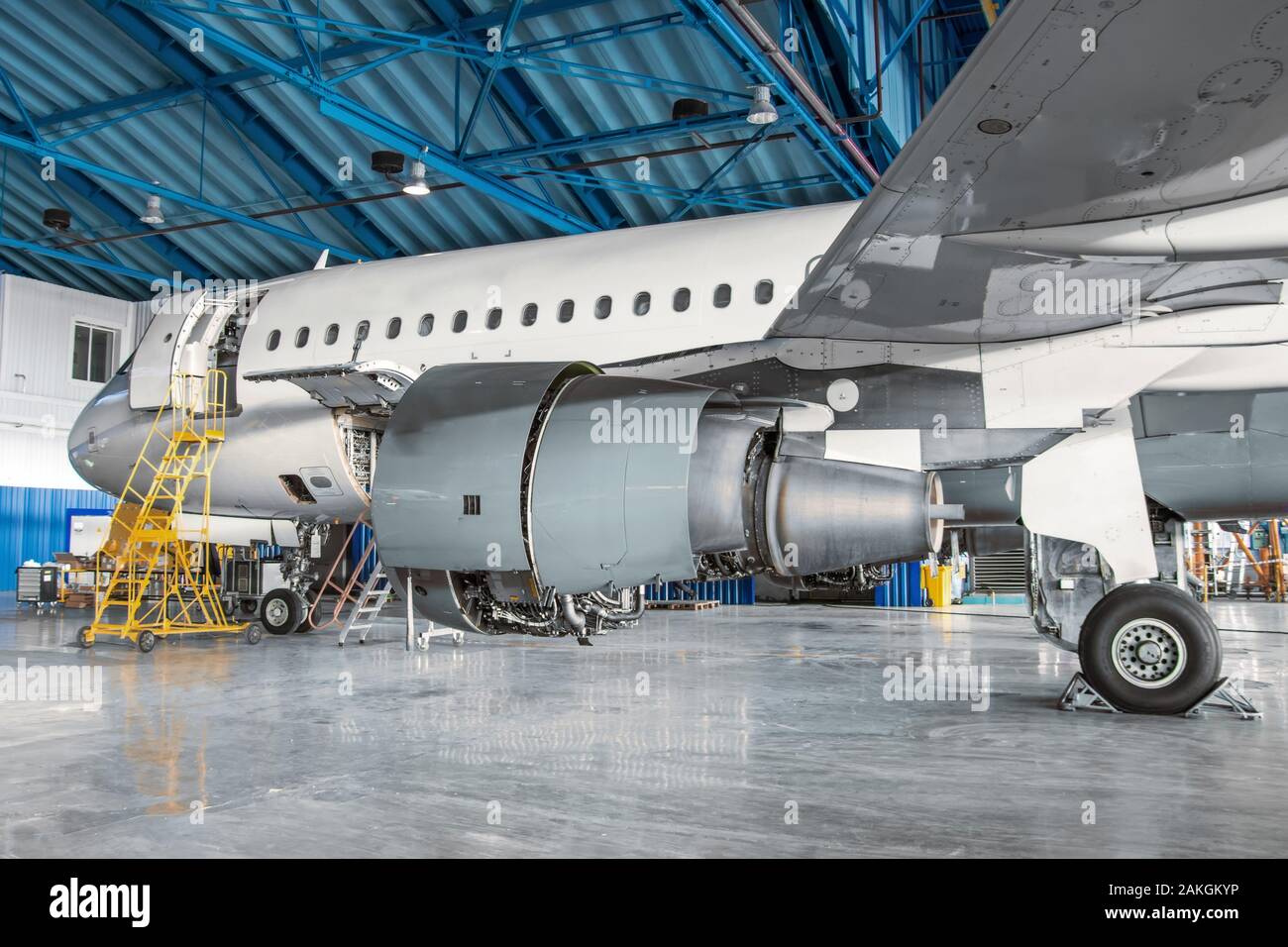 Narrow-body passenger aircraft for maintenance in the hangar, side view ...
