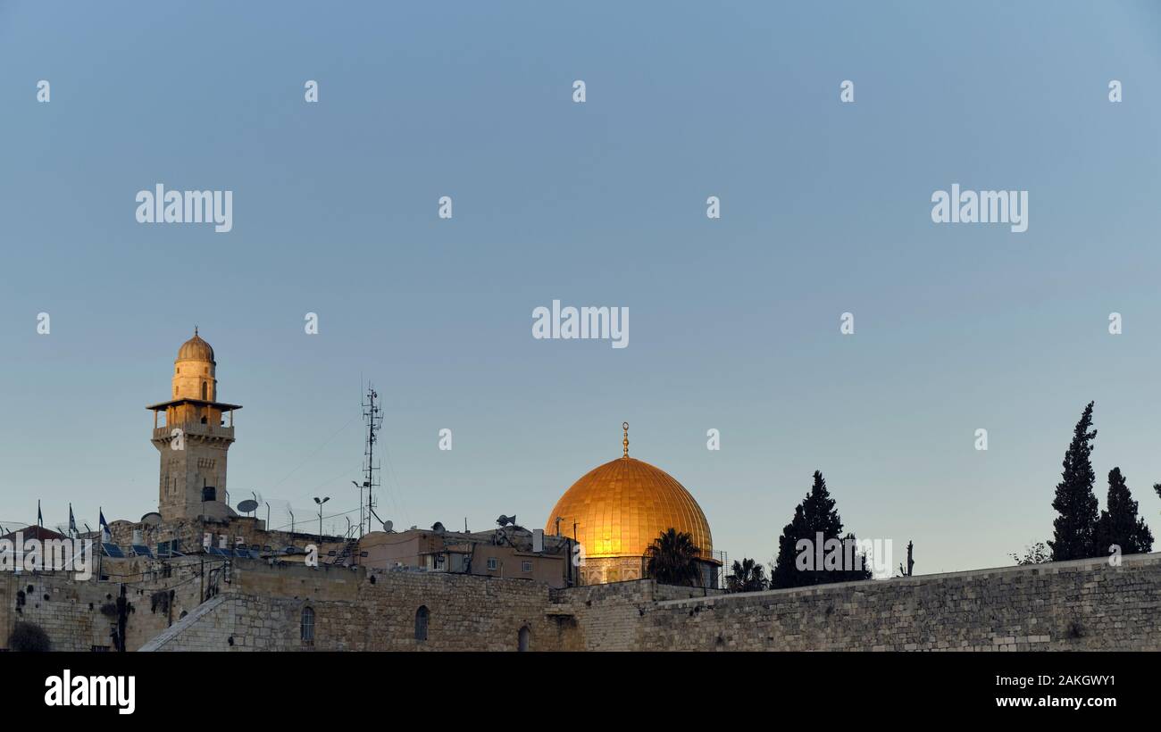 Wall of Jerusalem's Old City and clear blue sky with clouds in a sunny ...