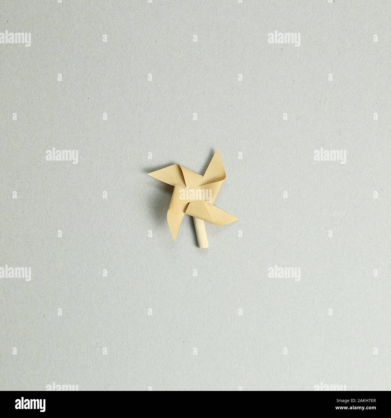 Brown kraft paper pinwheel on gray background Stock Photo - Alamy