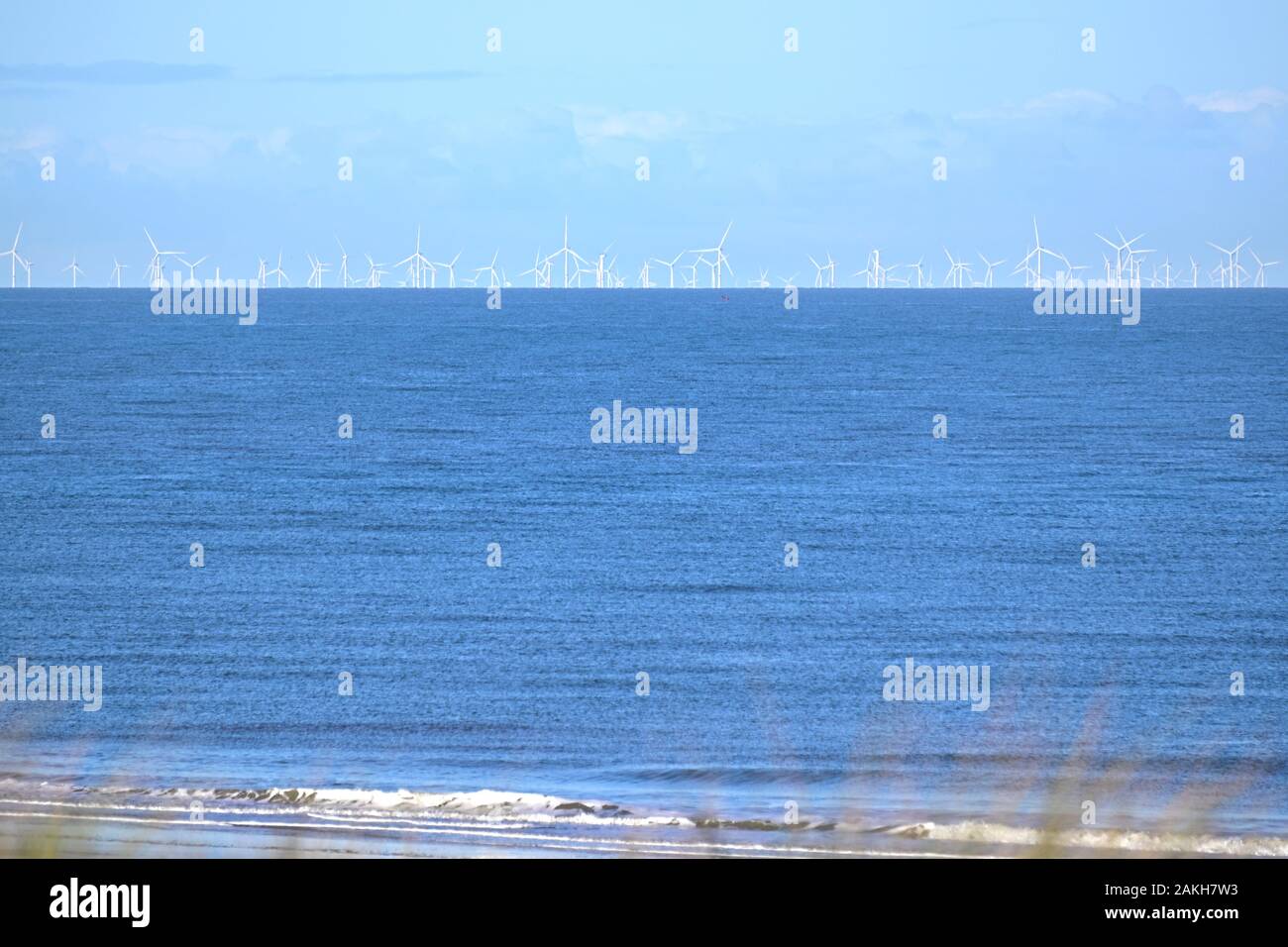 Offshore wind farm in the north sea as seen from the beach in Cadzand ...