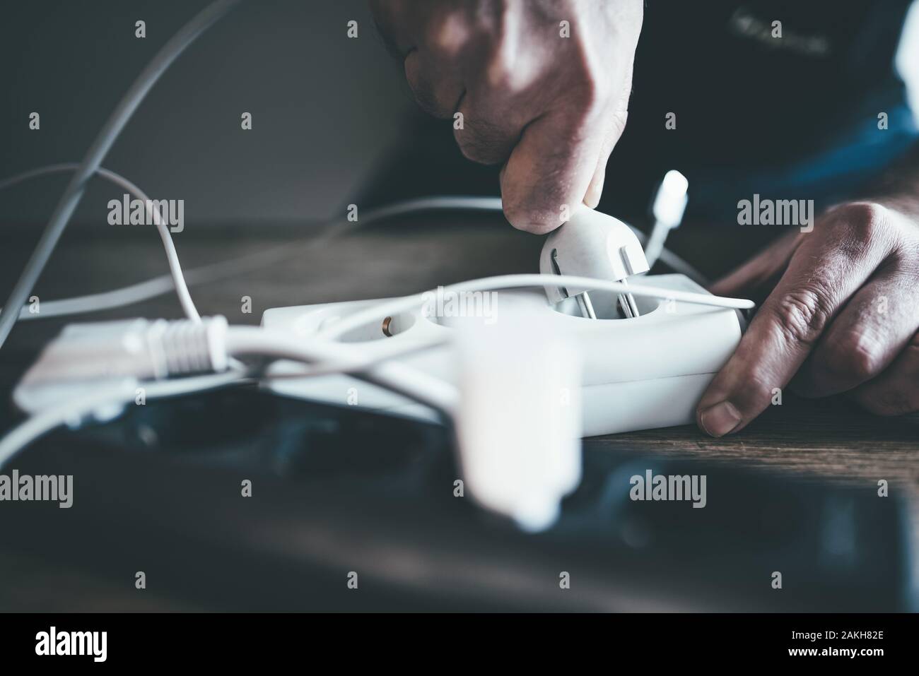 Man plugging in power hi-res stock photography and images - Alamy