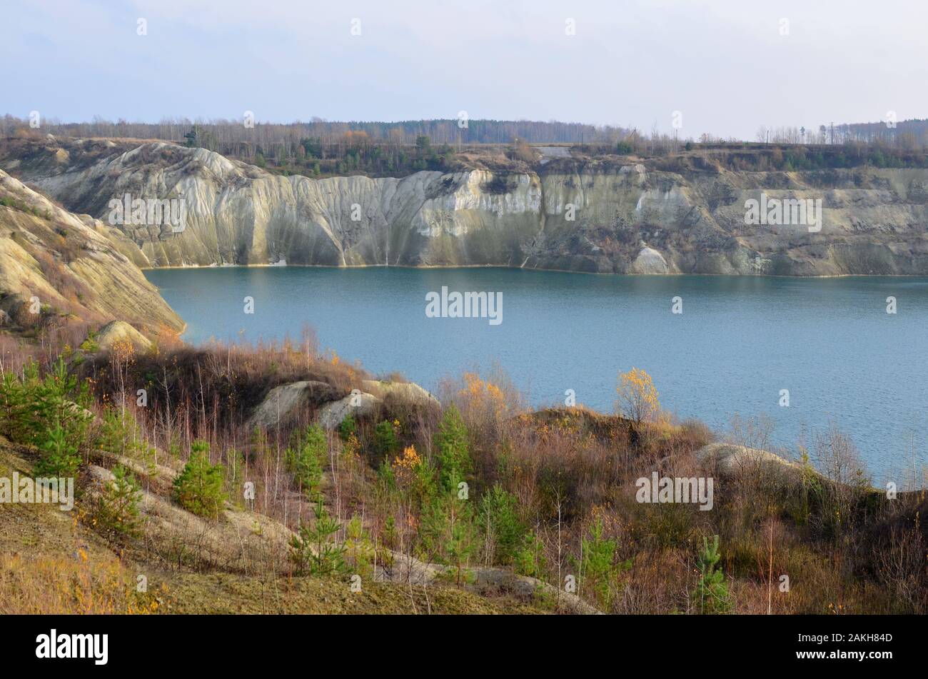 Chalk quarry artificial lakes in autumn season. Technogenic open pit is ...