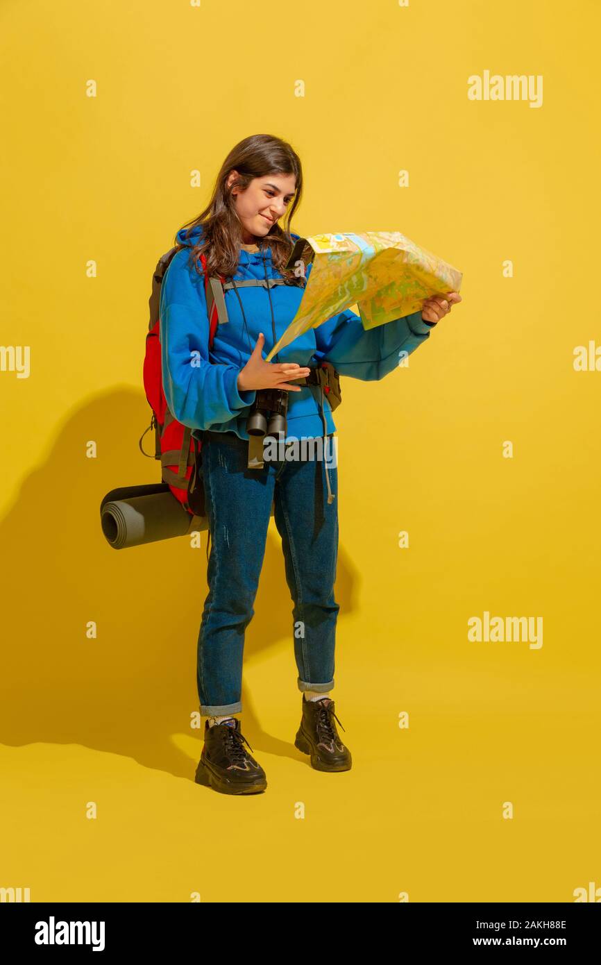 Smiling, looking for way. Portrait of a cheerful young caucasian ...