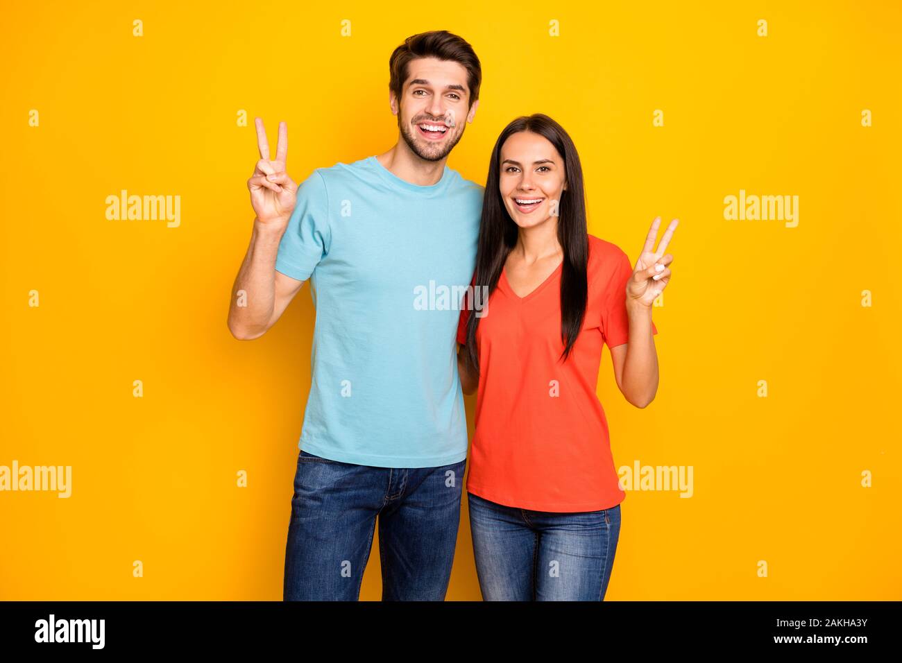 Photo of funky two people couple guy and lady showing v-sign symbols ...