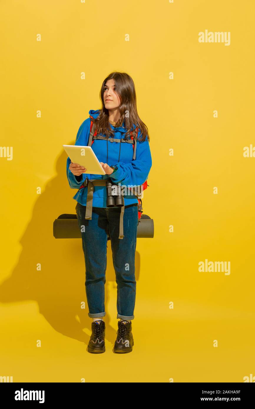 Looking for way with map. Portrait of a cheerful young caucasian ...