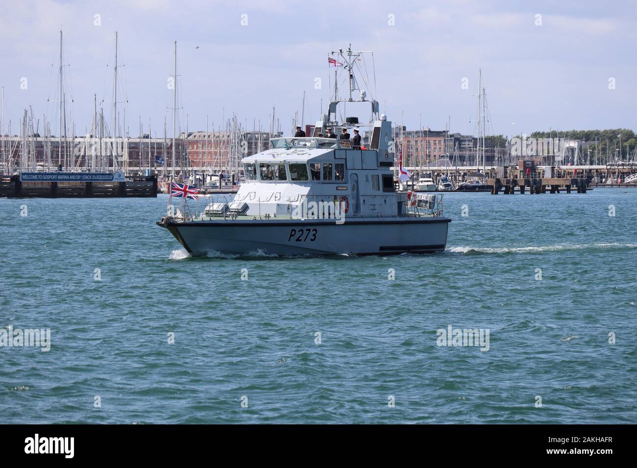The Royal Navy P2000 Fast Training Boat HMS PURSUER acts as an escort ...