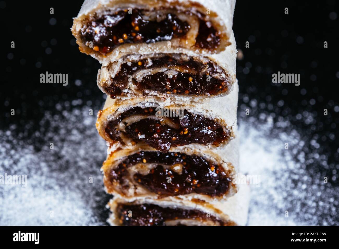 Fresh fig rolls on the dark background Stock Photo - Alamy