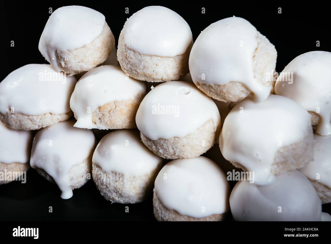 Small round coconut biscuits on the dark background Stock Photo - Alamy