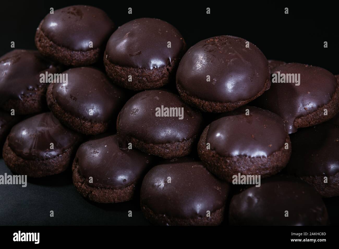 Small round chocolate cakes on the dark background Stock Photo - Alamy