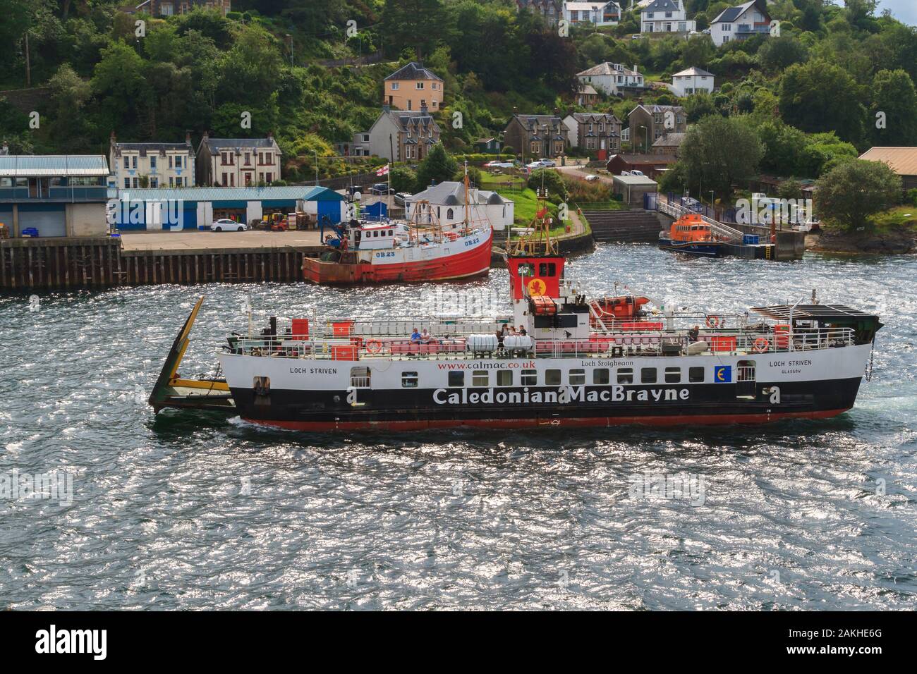 MV Loch Striven approaches dock with front ramp beginning to lower. One ...