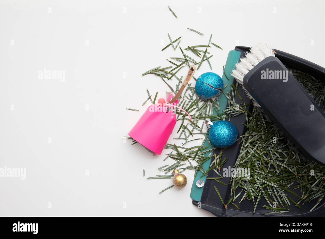 Sweeping up pine needles and broken decorations after Christmas holiday ...