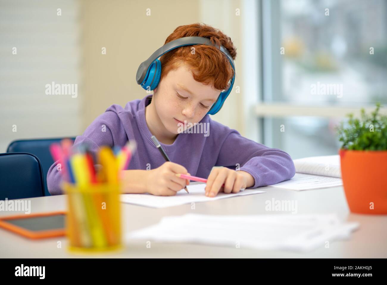 Little boy being focused on his tasks Stock Photo - Alamy