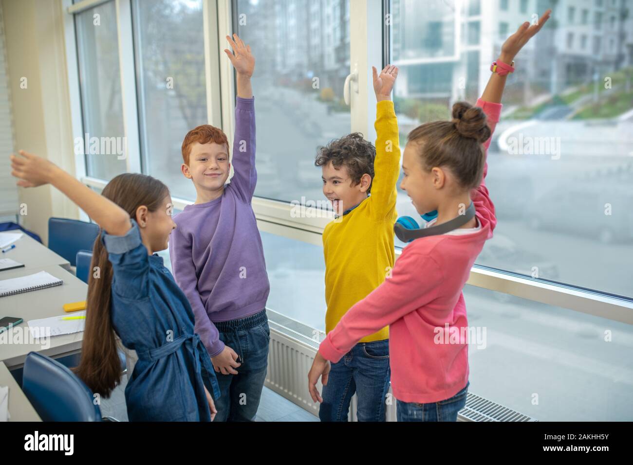 Children playing during their lesson at school Stock Photo - Alamy