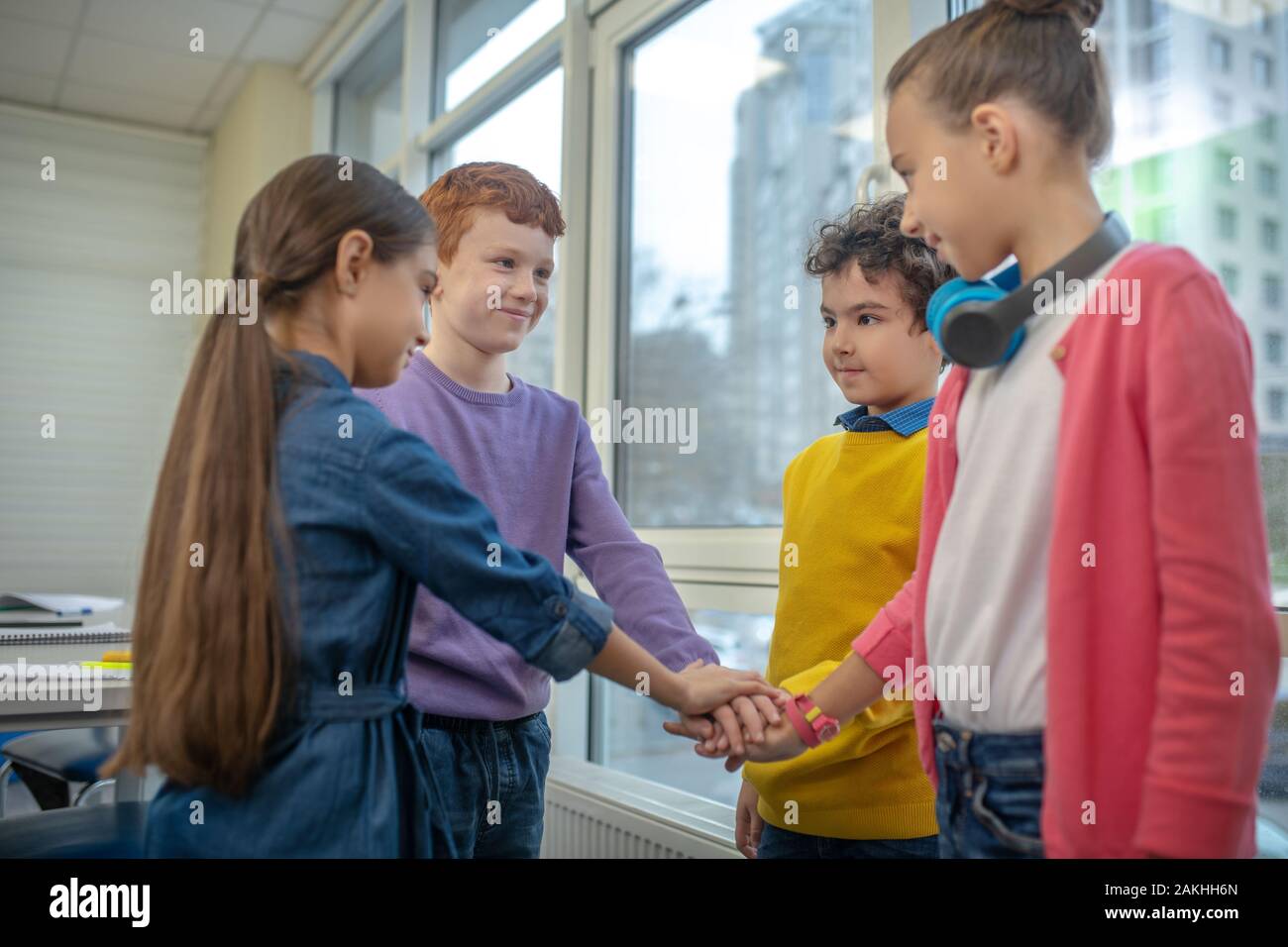 Cheerful classmates playing during their school break Stock Photo - Alamy