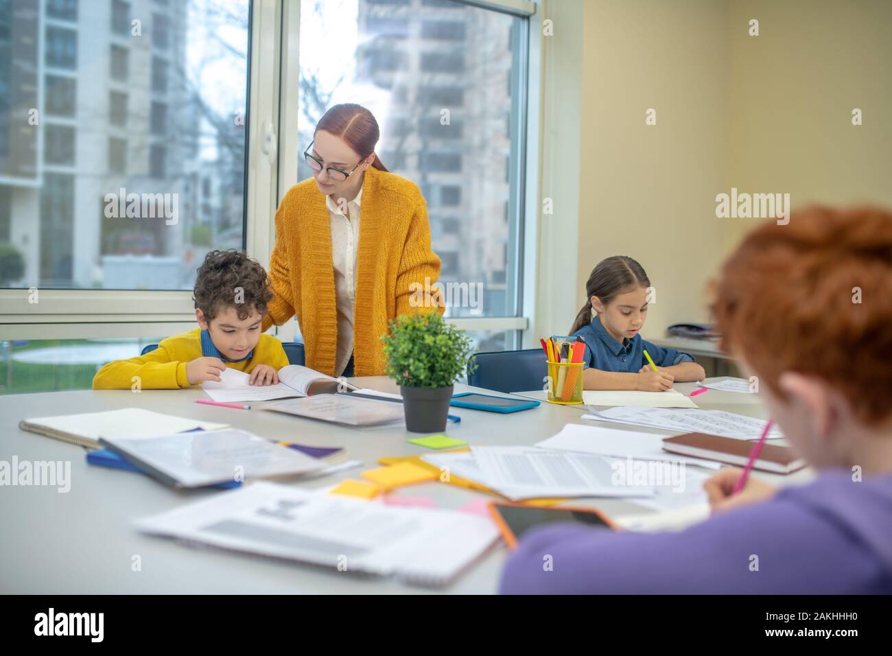 Kid checking book hi-res stock photography and images - Alamy