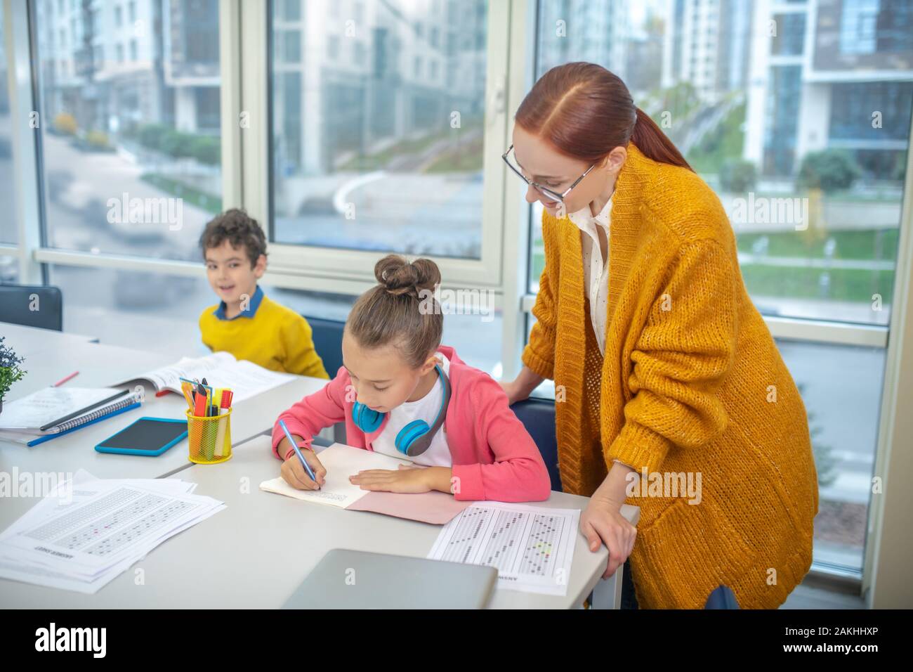 Teacher using individual approach during the class Stock Photo - Alamy
