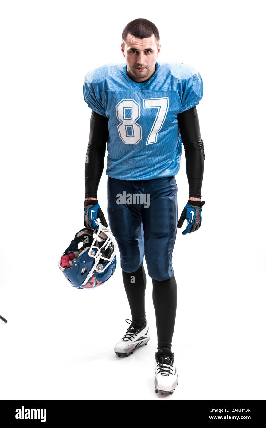 American Football Player with blue uniform on the scrimmage line. White ...