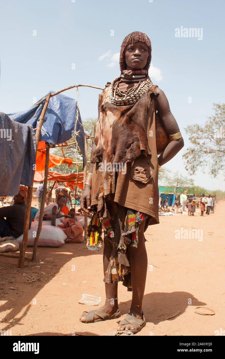 Banna tribe woman wearing clothes in animal skin at weekly market ...