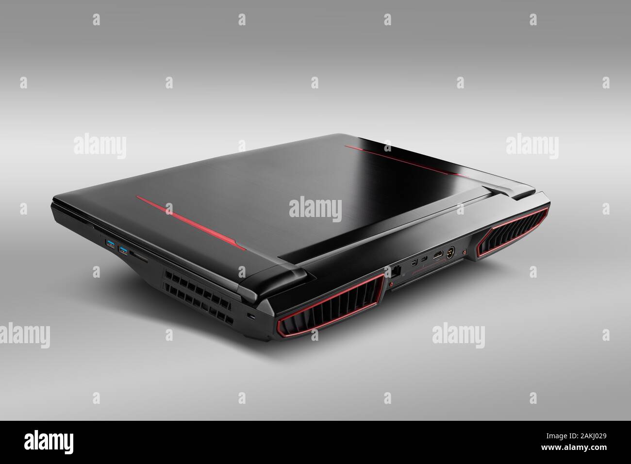 Photography of gaming laptop from the back side, placed on gray ...