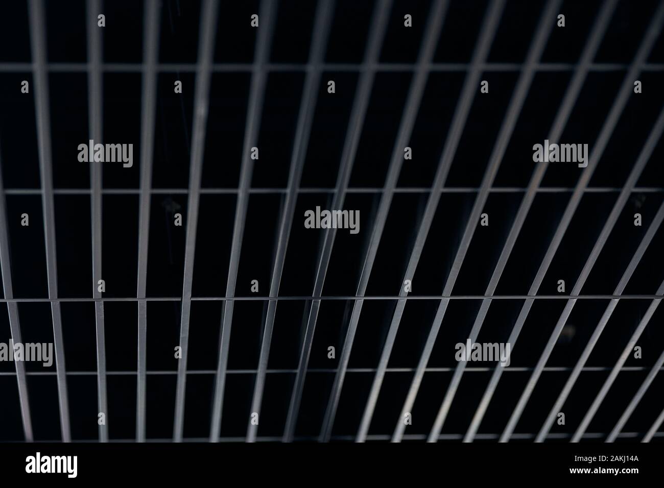 Office grille ceiling. Modern black metal grille ceiling, suspended ...