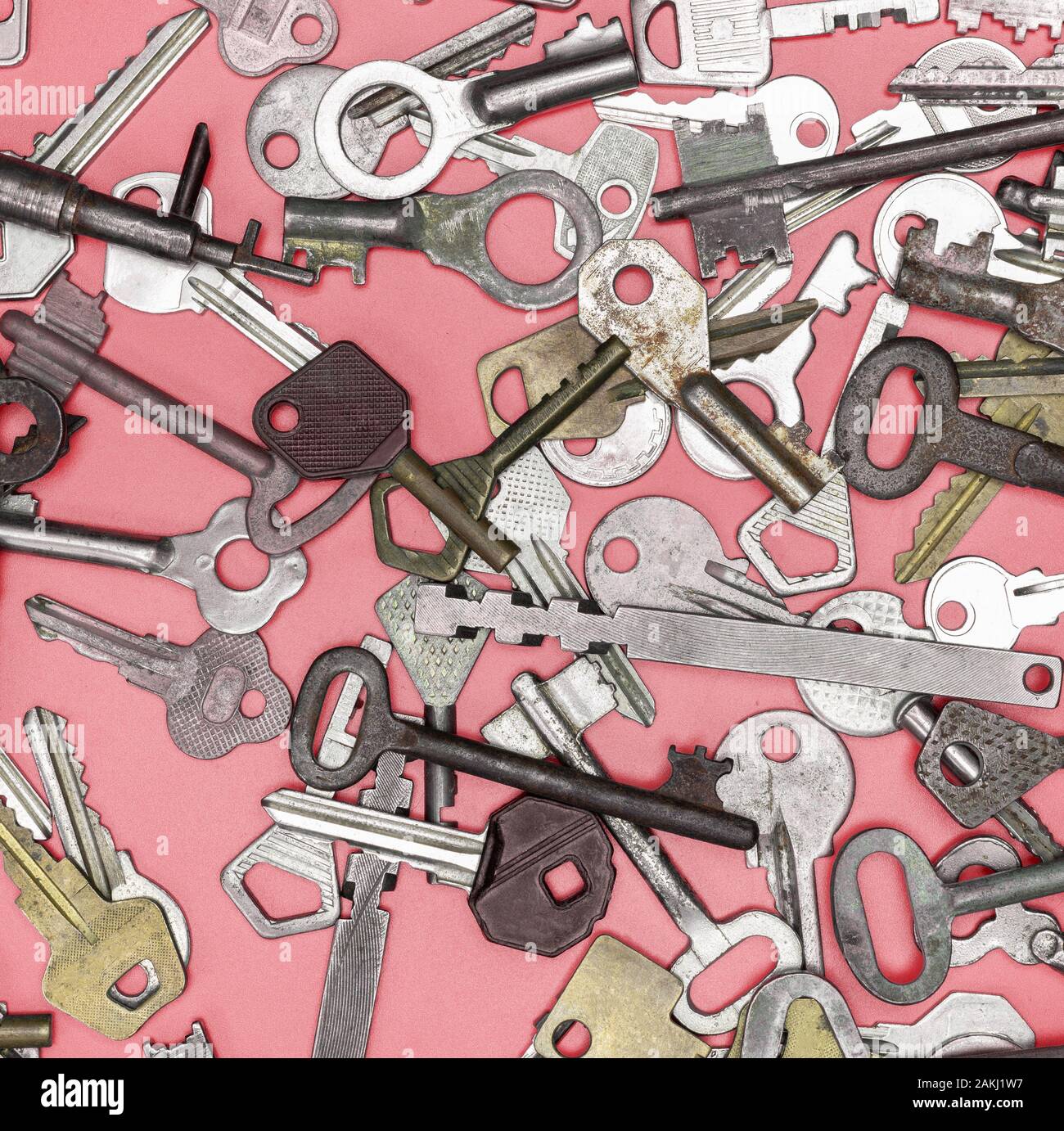 Keys set on pink background. Door lock keys and safes for property ...