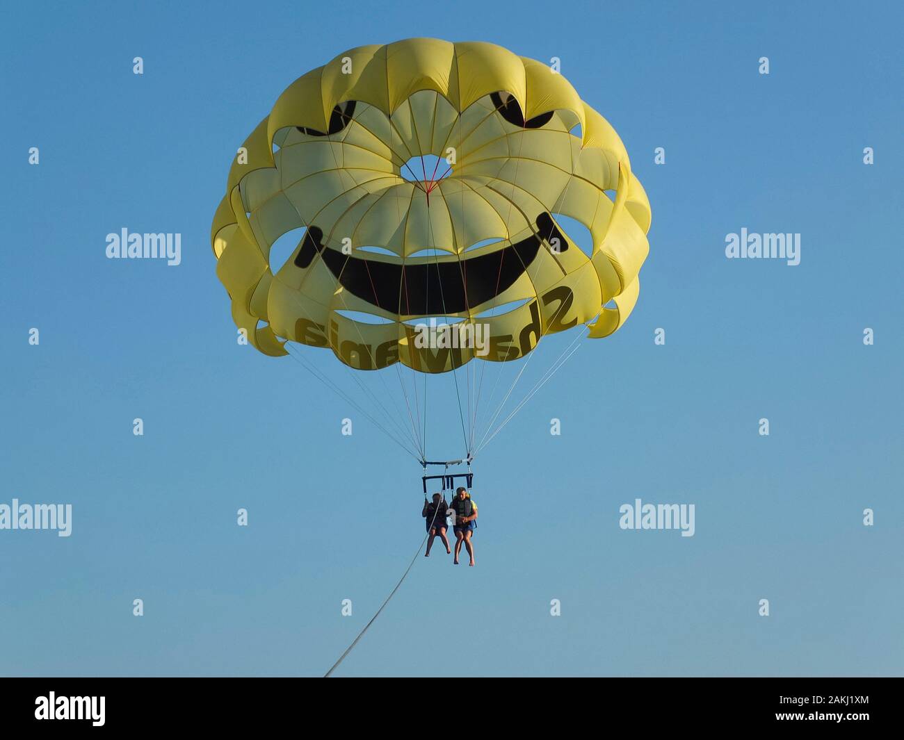 SHARM EL SHEIKH, EGYPT - June 19, 2015: Two people are flying on a ...