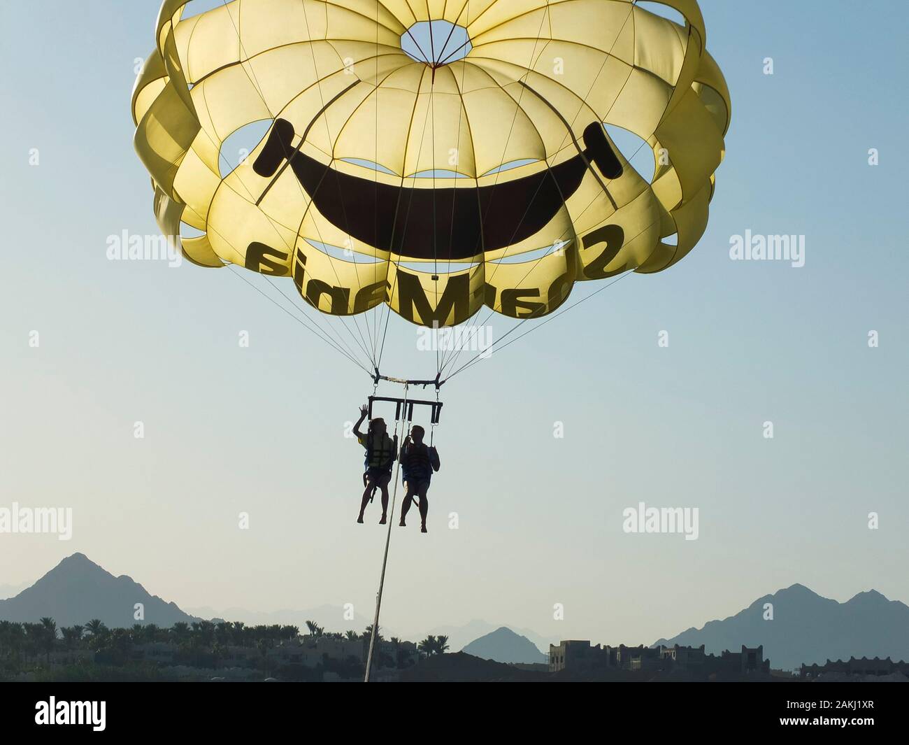 SHARM EL SHEIKH, EGYPT - June 19, 2015: Two people are flying on a ...