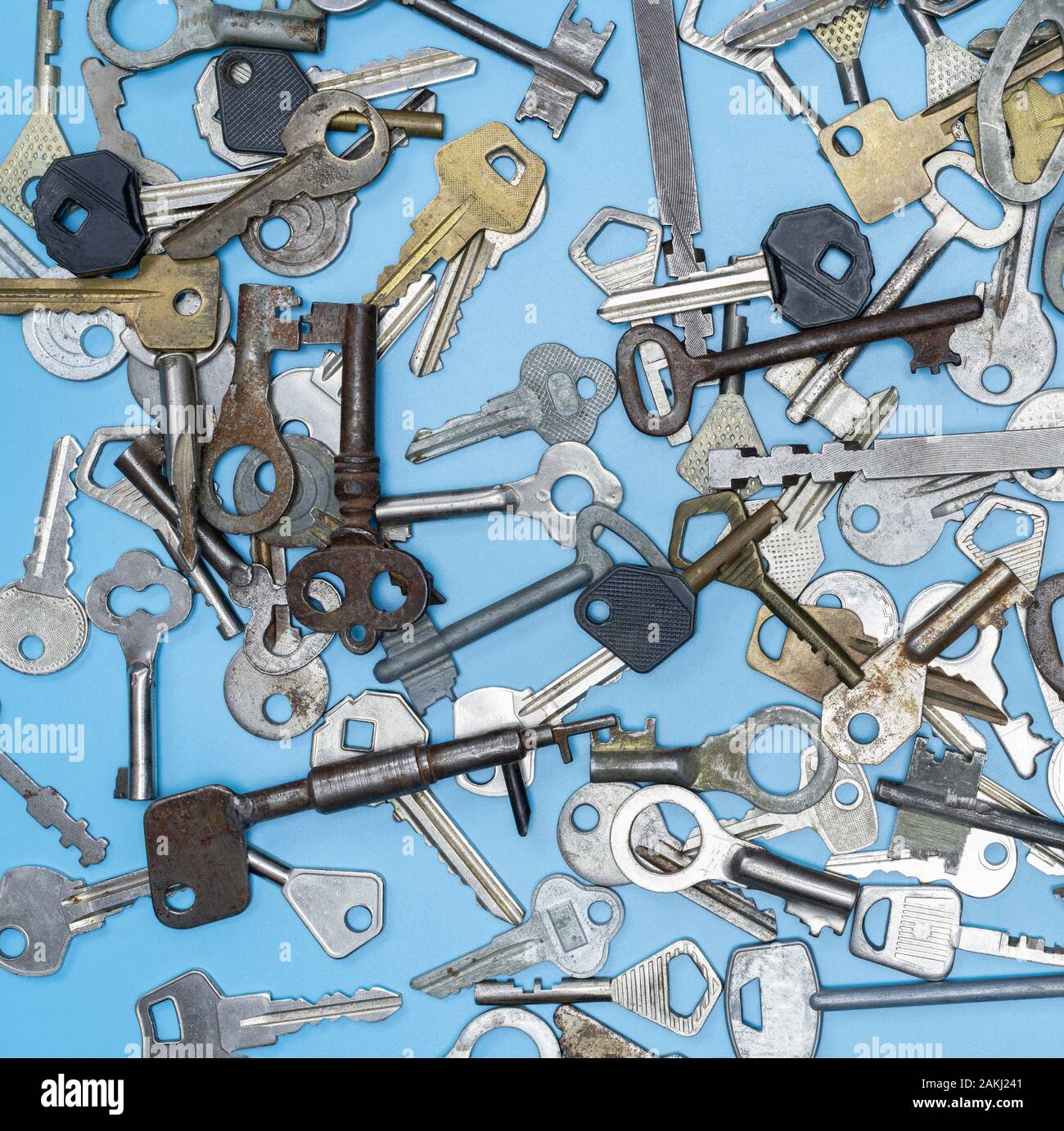 Keys set on blue background. Door lock keys and safes for property ...