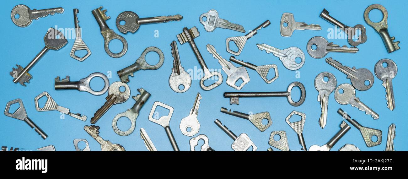 Keys set on blue background. Door lock keys and safes for property ...