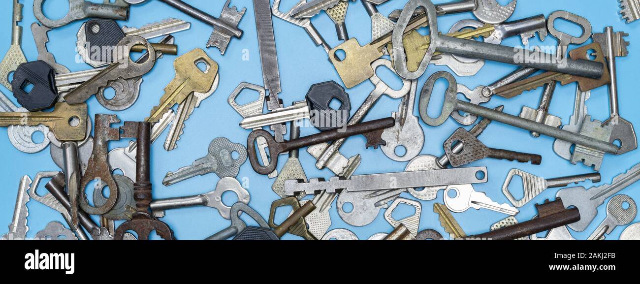 Keys set on blue background. Door lock keys and safes for property ...