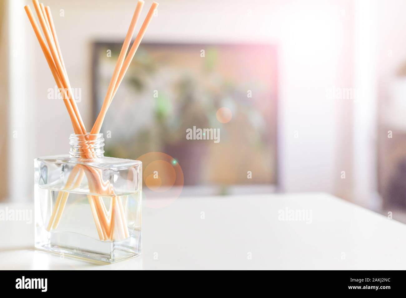 Reed diffuser to fragrance home interior on the coffee table of a light ...