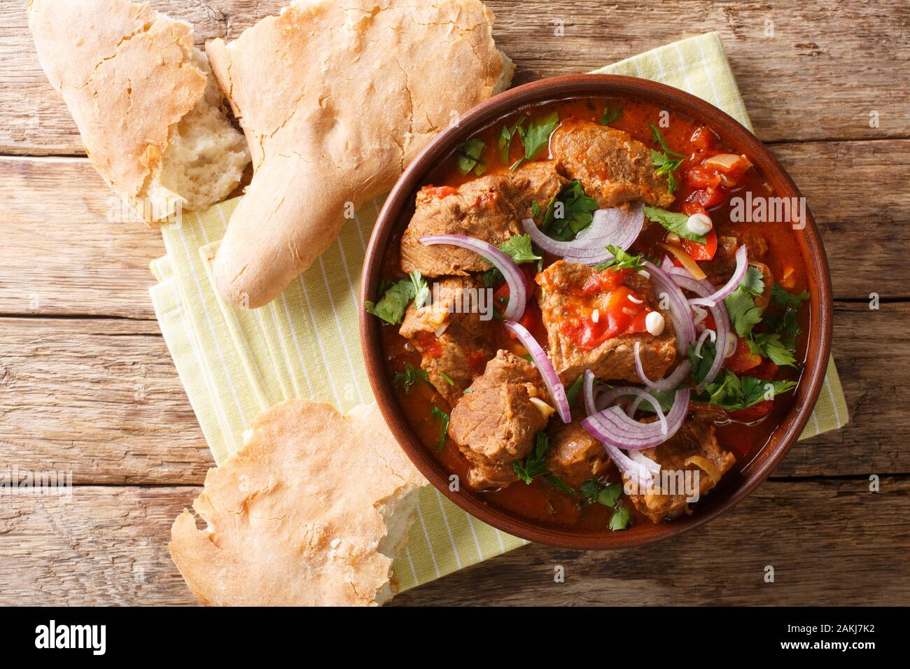 Georgian beef stew with spices in tomato sauce close-up in a bowl on ...