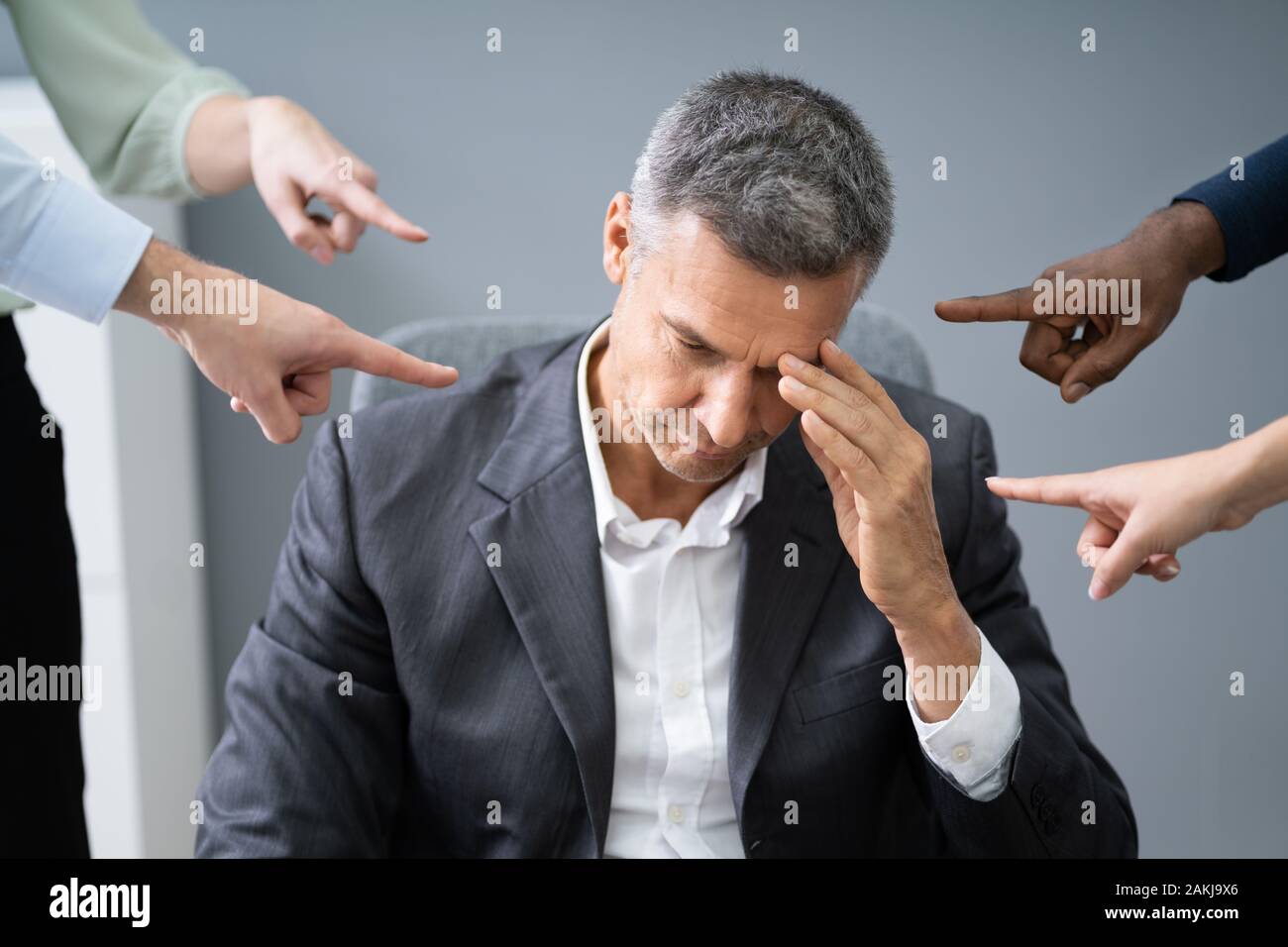 Many Hands Pointing The Stress Businessman At The Workplace Stock Photo ...