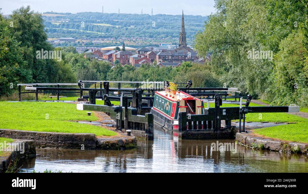Narrowboat in lock of the Wigan Flight on the Leeds and Liverpool Canal ...
