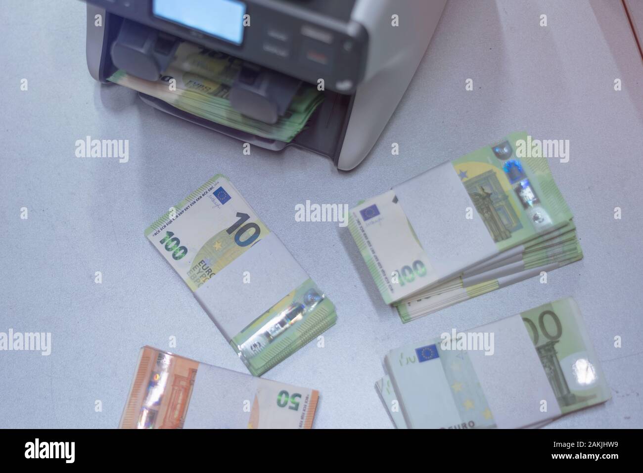 Bundles of banknotes divided into groups with currency straps placed on ...