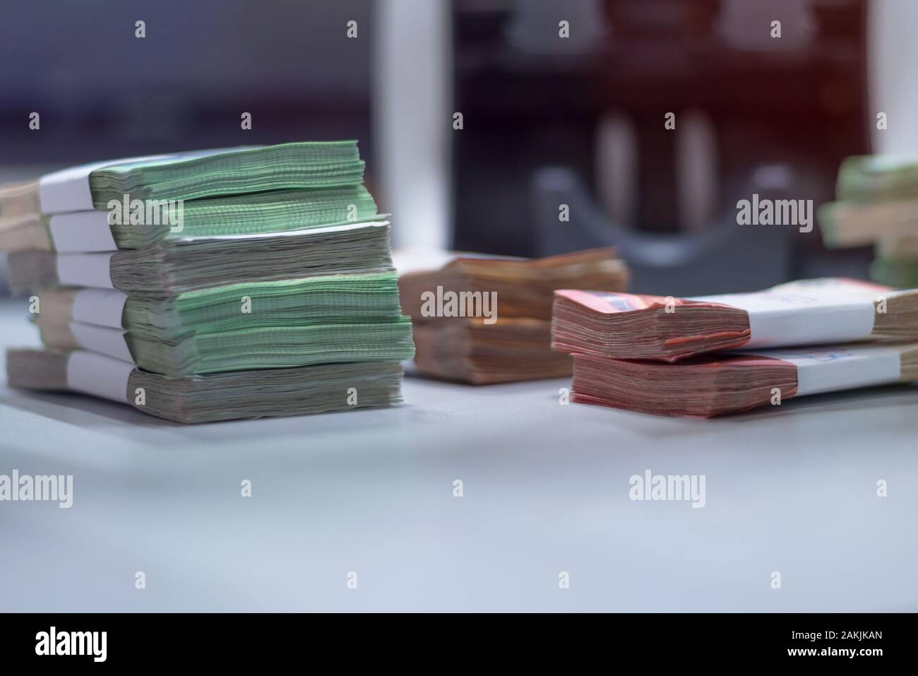 Bundles of banknotes divided into groups with currency straps placed on ...